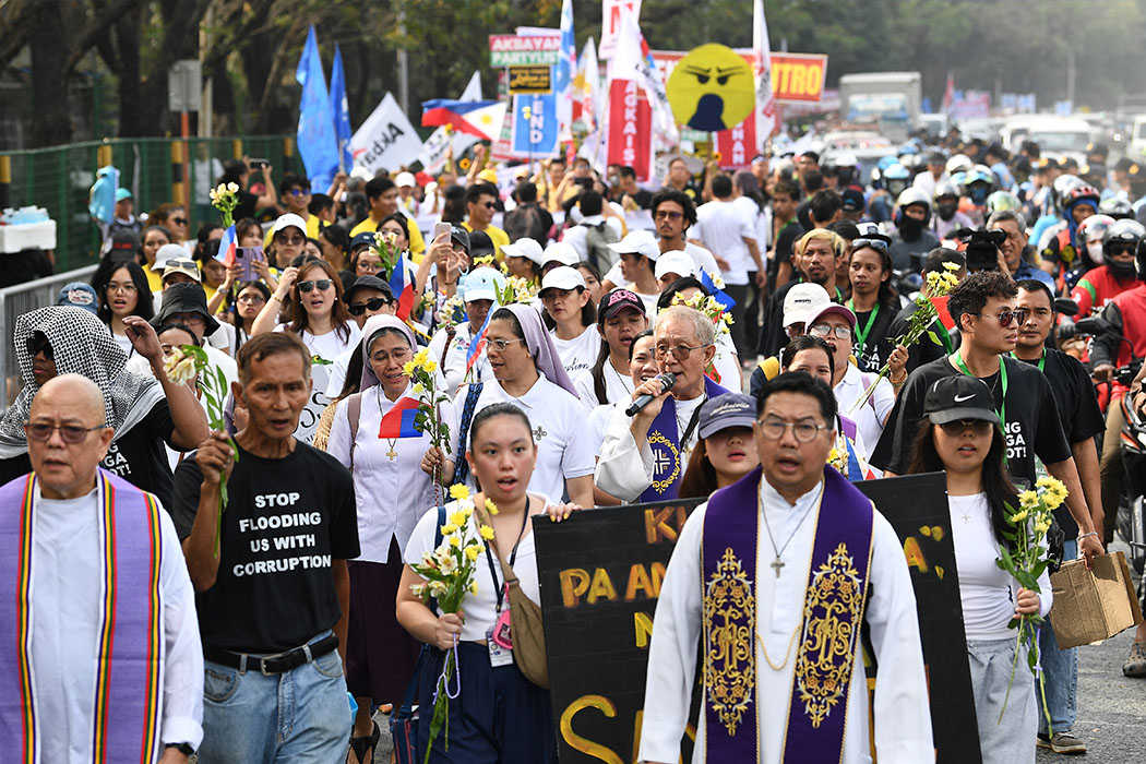 Filipinos protest corruption on anniversary of Ferdinand Marcos' ouster ...