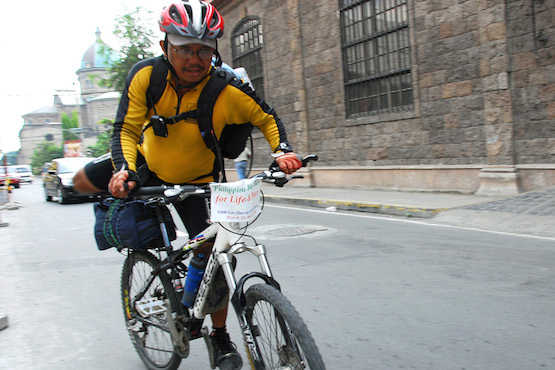 Filipino priest bikes for life to call for end to killings - UCA News